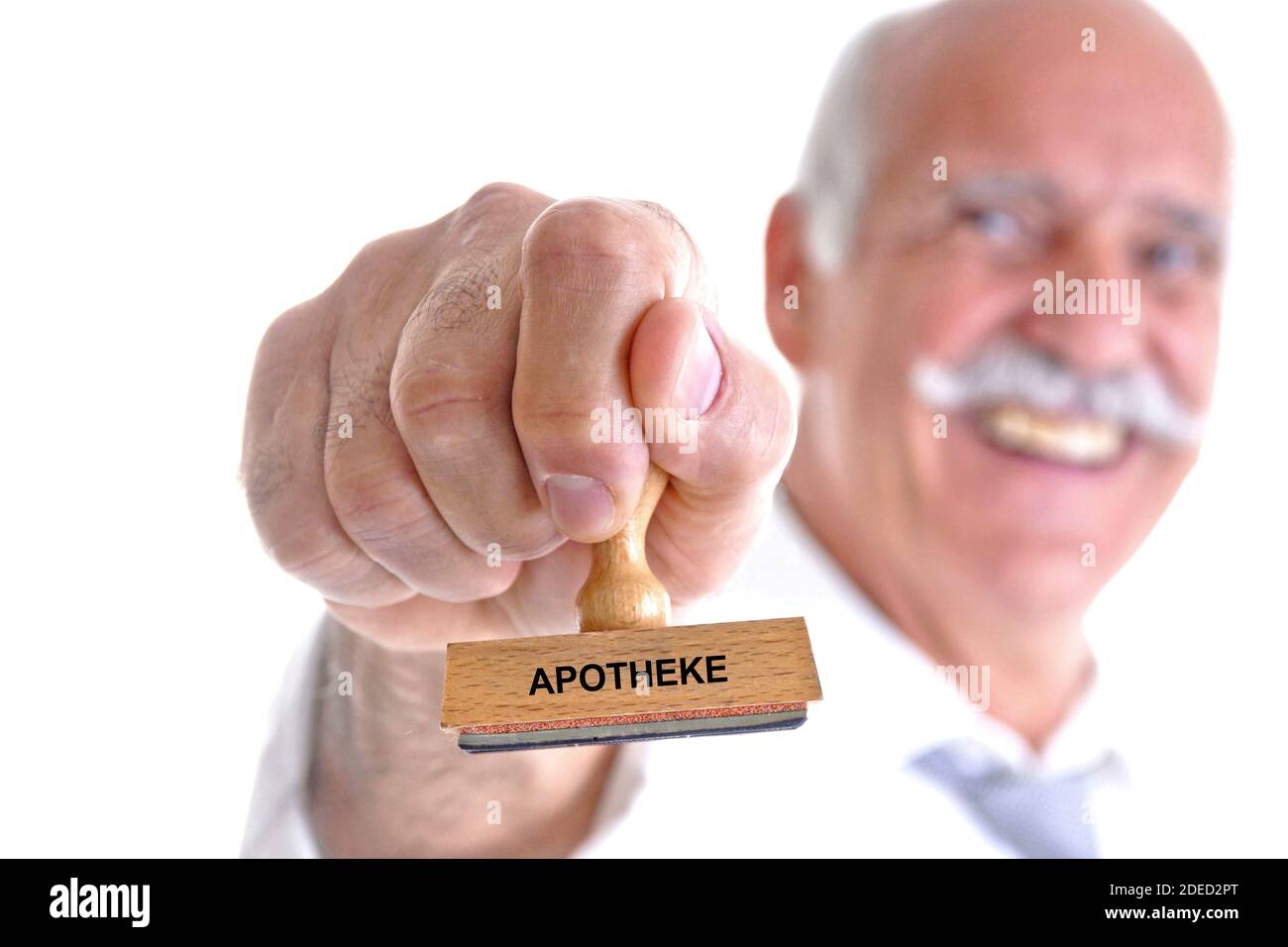 old man with stamp in his hand lettering Apotheke / pharmacy, Germany ...