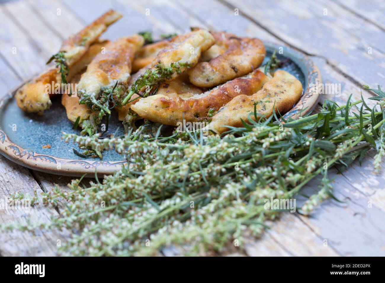 common mugwort, common wormwood (Artemisia vulgaris), home-baked small ...