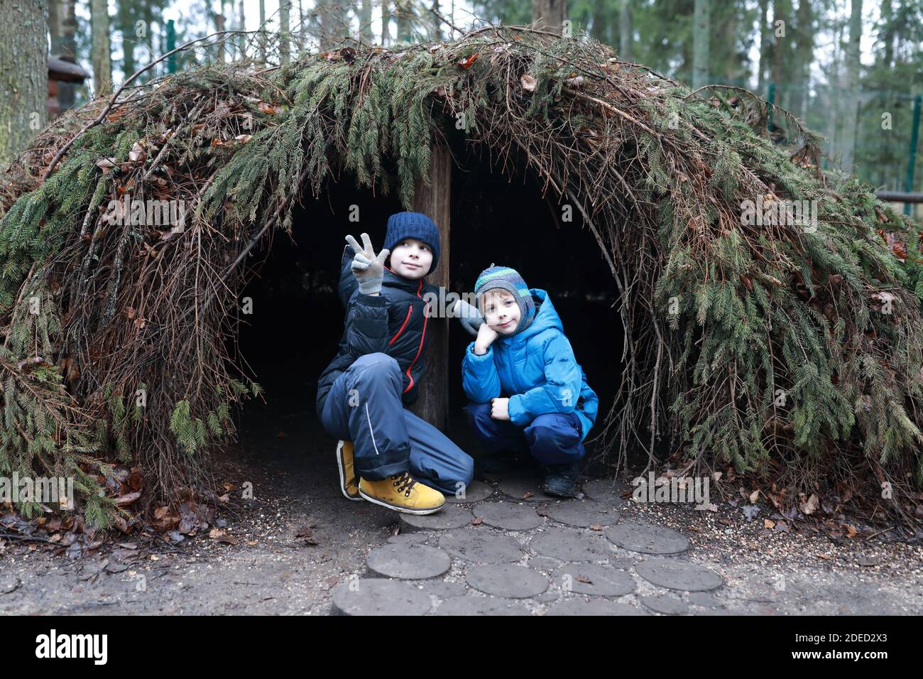Portrait of brothers in a fir hut Stock Photo - Alamy