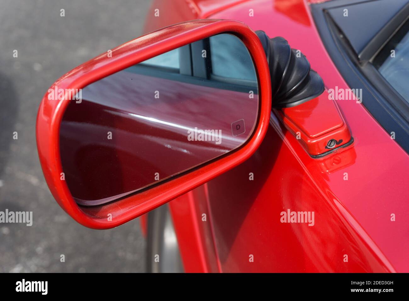 Close up detail of the left door mirror of a red Lamborghini Countach ...