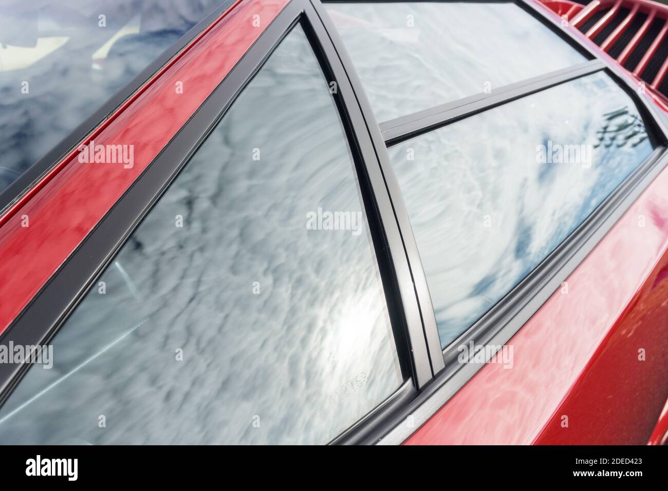 Close up detail of the door and side windows on a red Lamborghini ...
