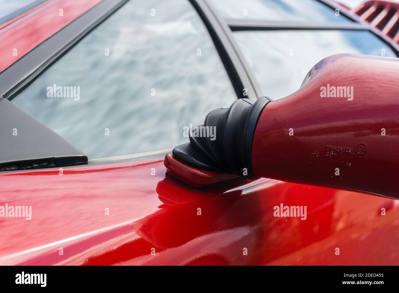 Close up detail of the door and side windows on a red Lamborghini ...