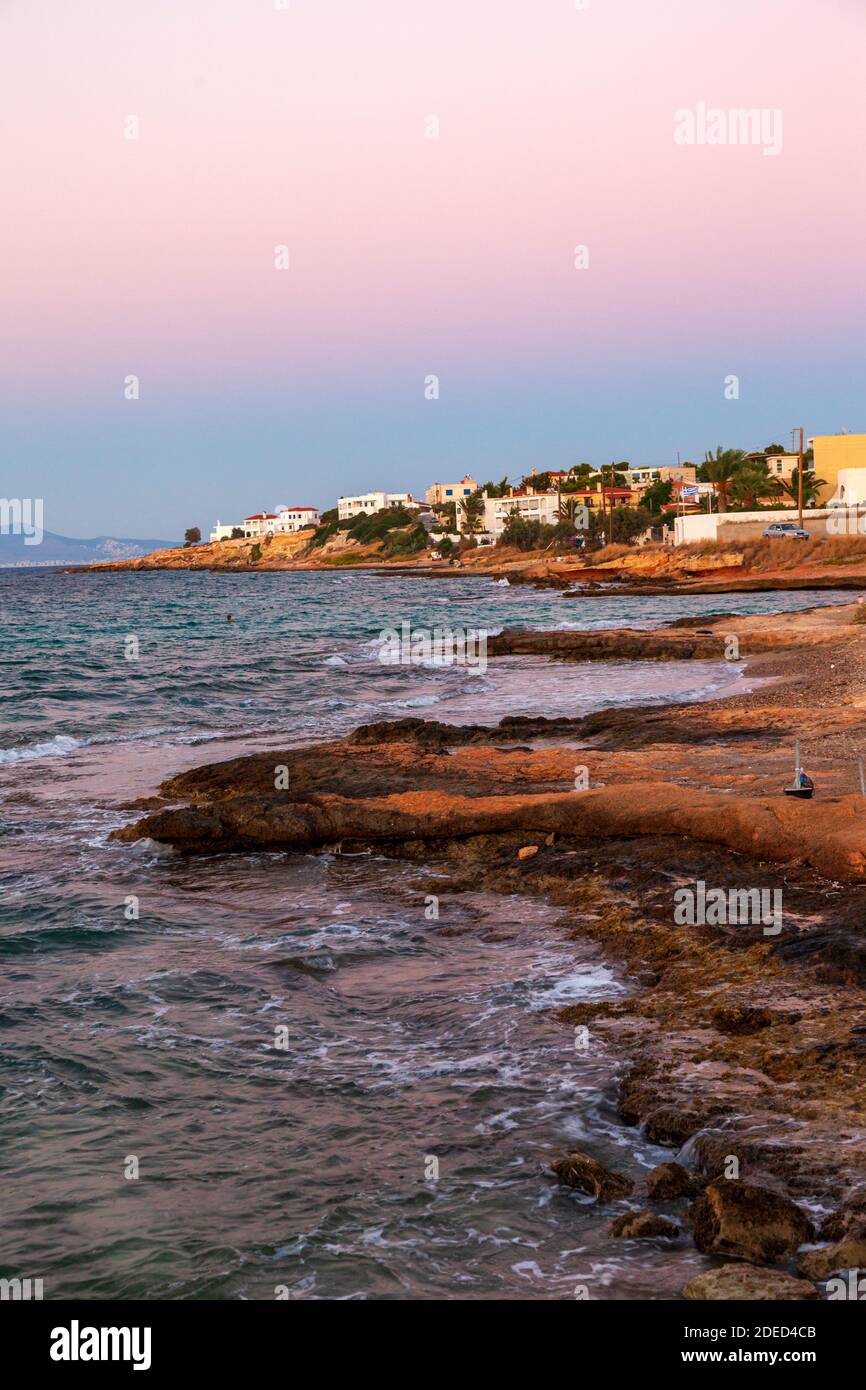 Sunset at a rocky beach near Souvala village, in Aegina island, Attica ...