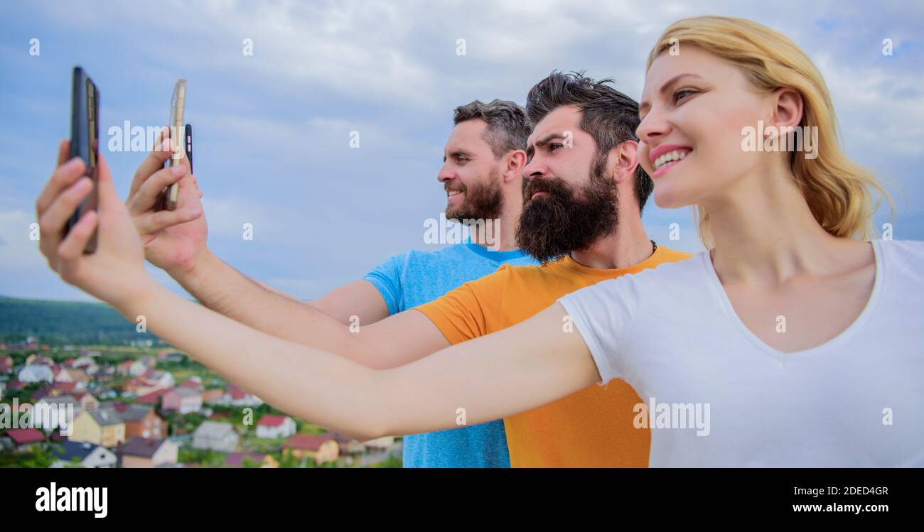 Happy best friends taking selfie with camera Stock Photo - Alamy