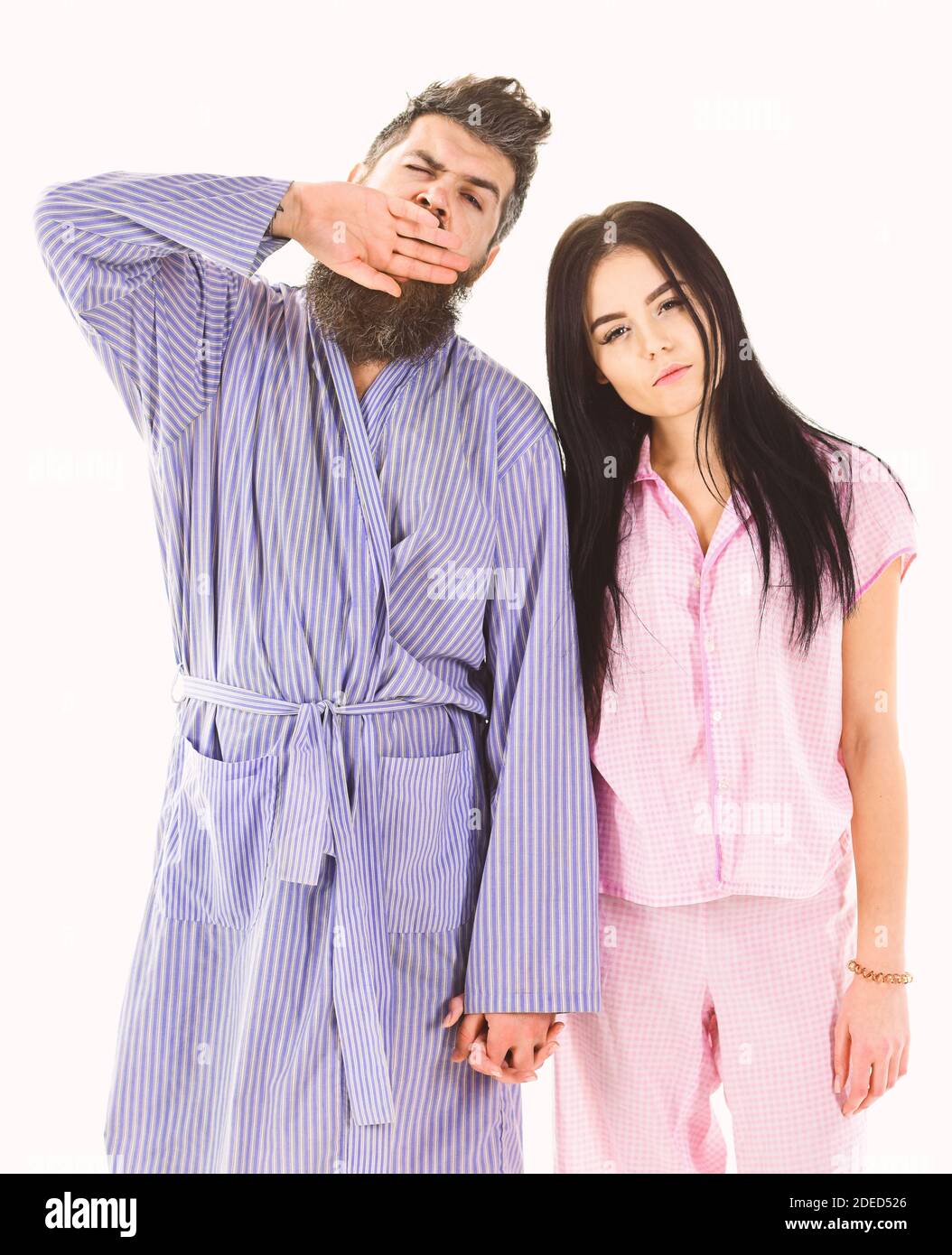 Couple, family on sleepy faces, yawning in clothes for sleep looks ...