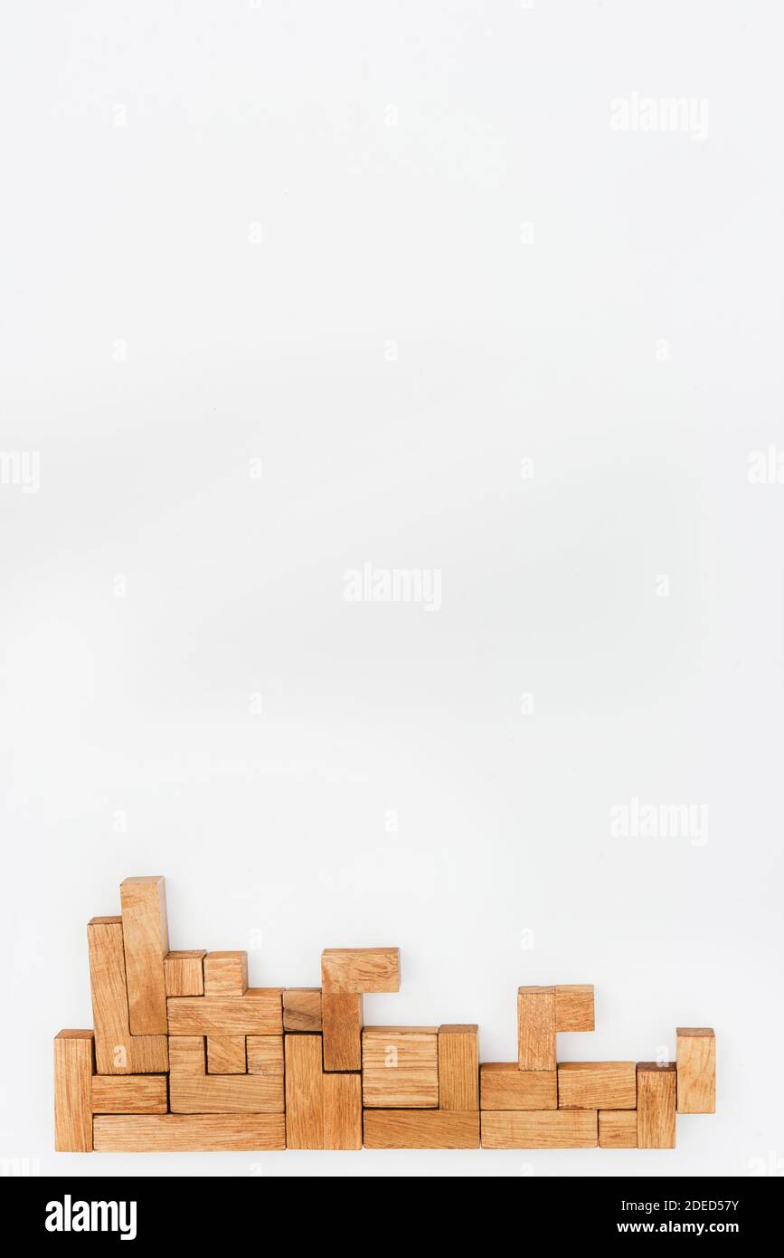 Wooden puzzle pieces as background Stock Photo - Alamy