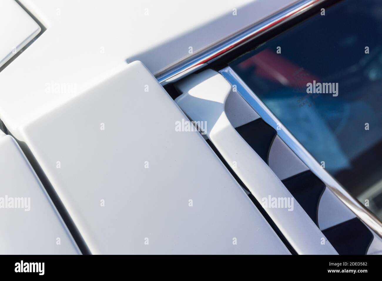 Close up of the top of the roof and right door pillar of a white ...