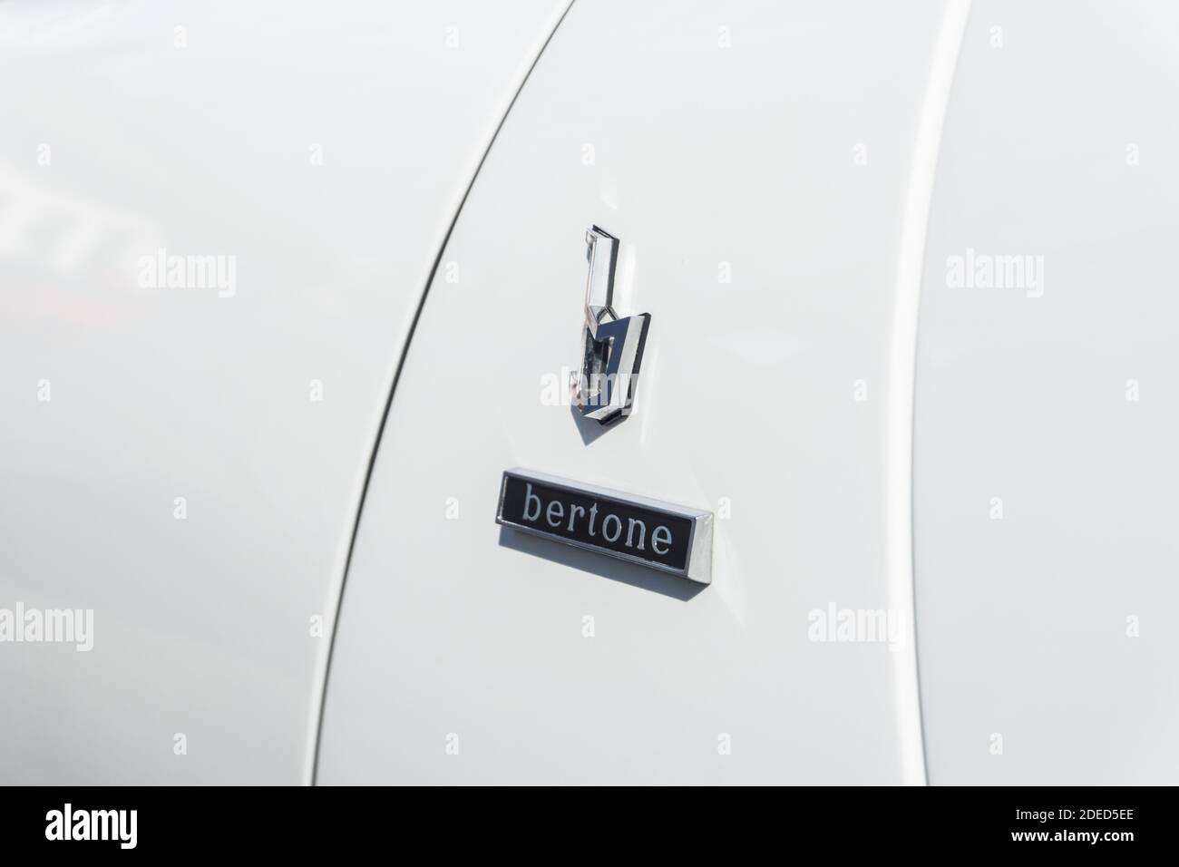 Close up of the Bertone logo and name badge on the side of a classic ...