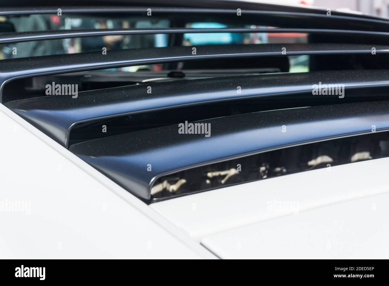 Close up of the black louvered rear window and engine cover of a white ...