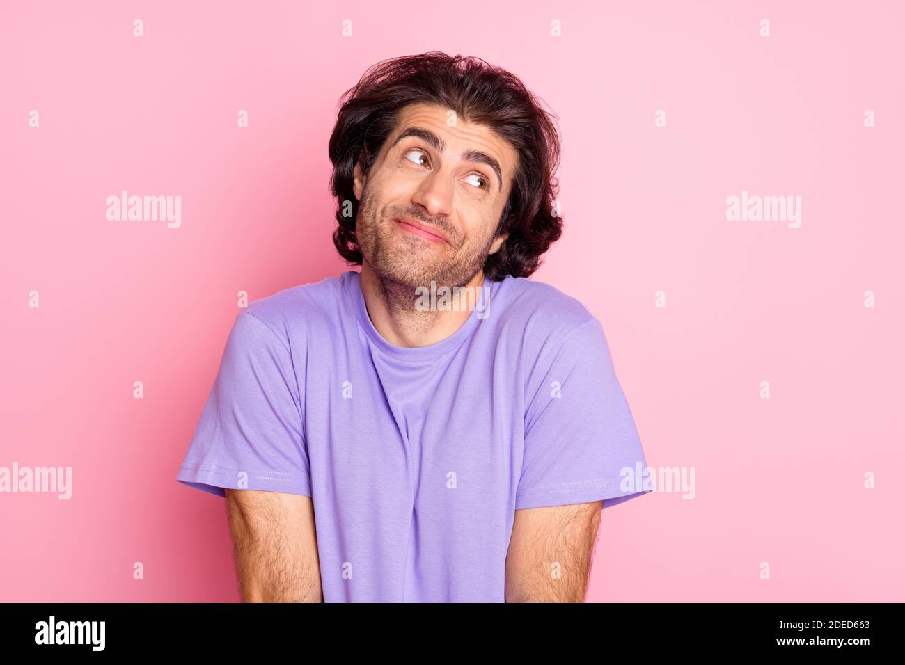 Photo of shy guy look empty space funny face wear violet t-shirt ...