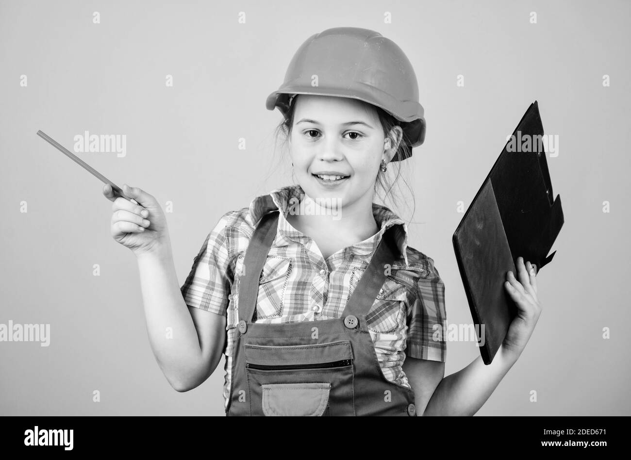small girl repairing in workshop. Foreman inspector. Repair. Safety ...