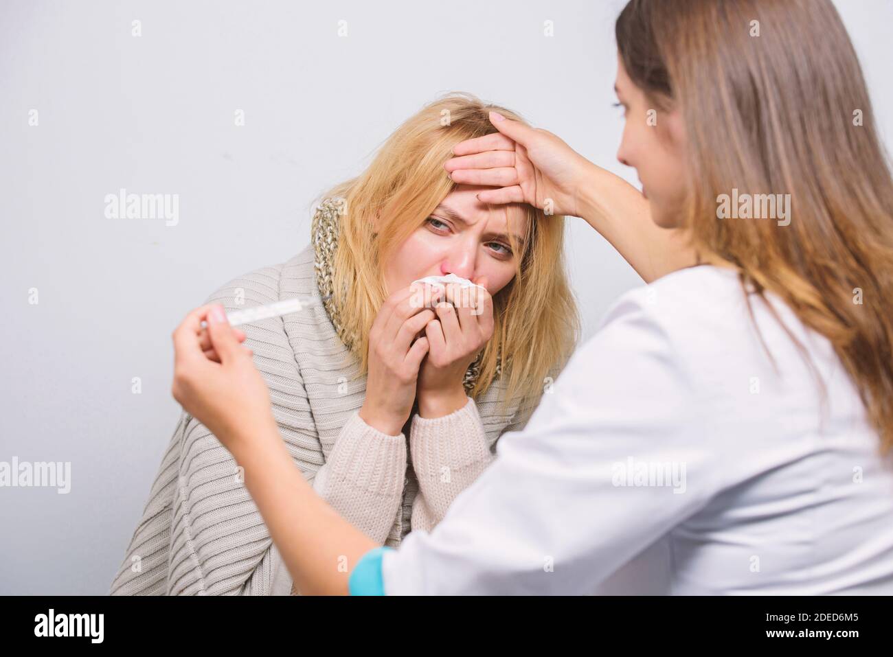 Treatment and when to call doctor. Doctor woman examine sick person ...