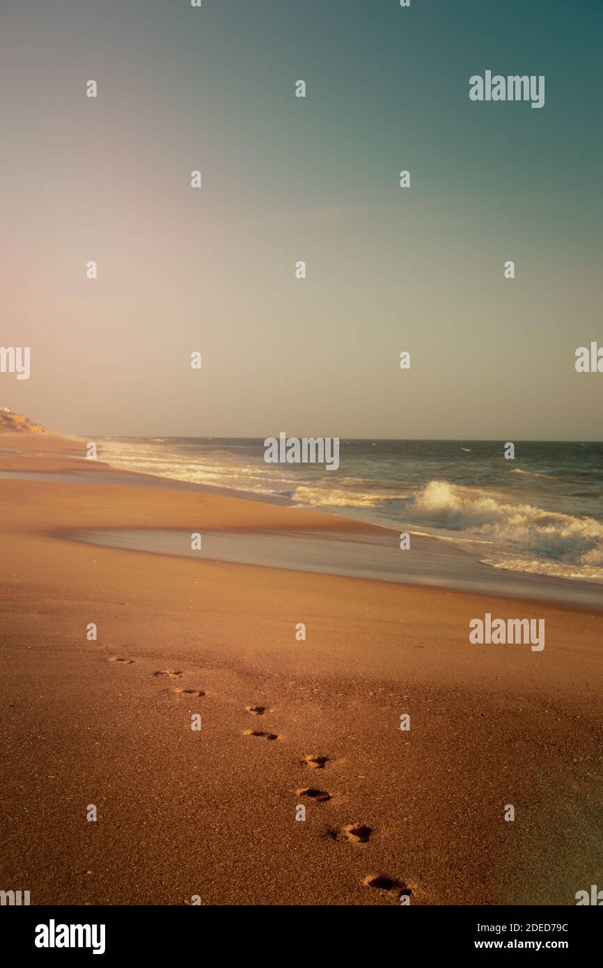 Footsteps on the beach Stock Photo - Alamy