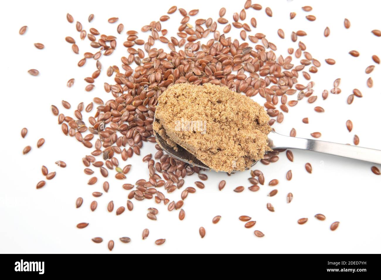 ground flaxseed on a white background. vitamins and healthy food Stock ...