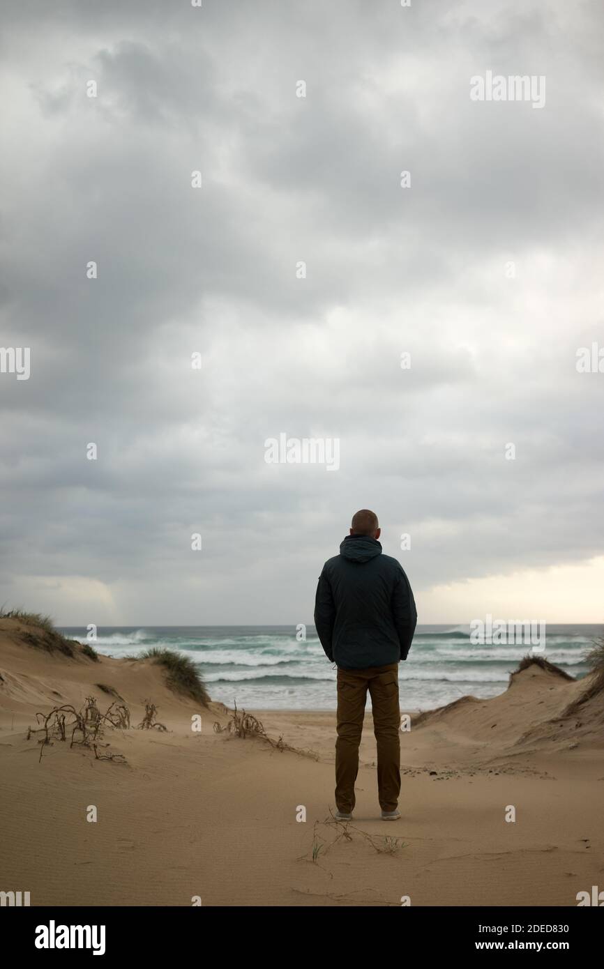 Man standing in ocean waves hi-res stock photography and images - Alamy