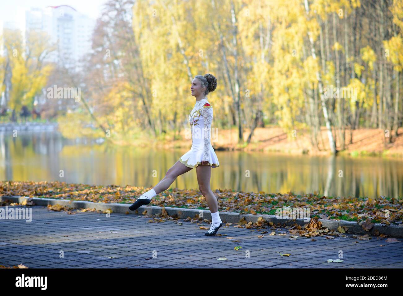 Ballerina dancing in nature park among autumn leaves Stock Photo - Alamy