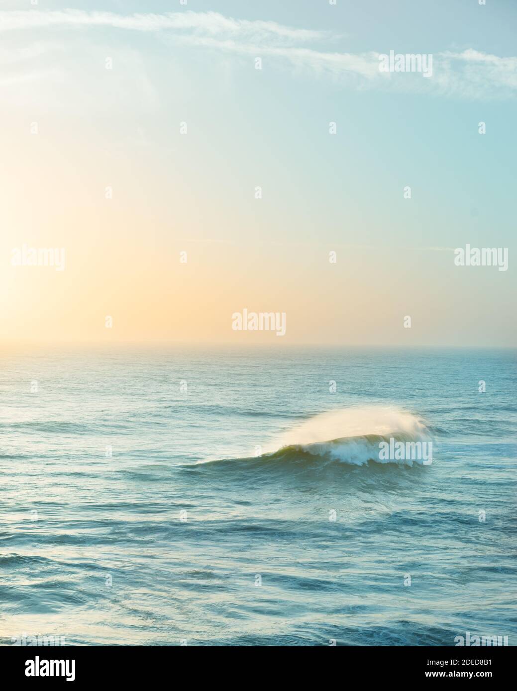 A single wave on the ocean beautiful colors at sunset single wave on ...