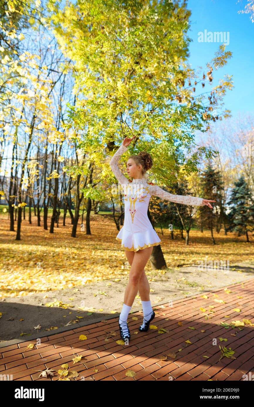 Ballerina dancing in nature park among autumn leaves Stock Photo - Alamy