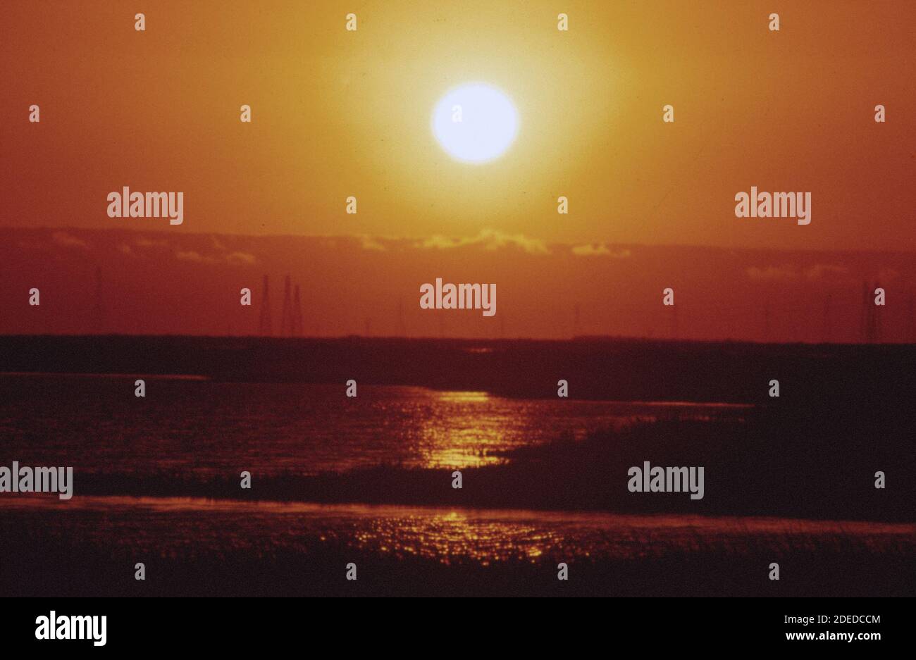 1970s Photo (1972) - Setting sun; smog and derricks (San Francisco Bay ...