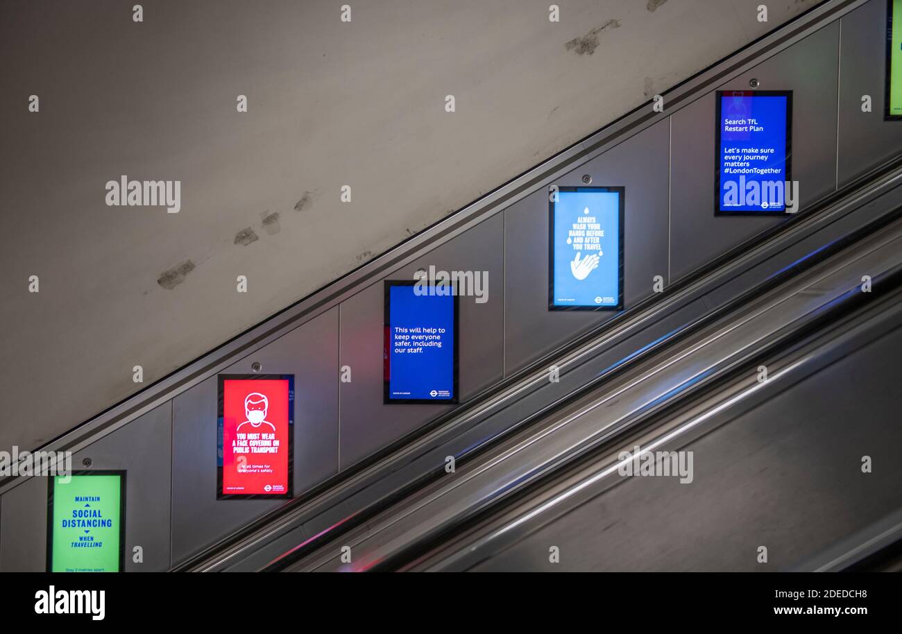 Escalators lined with covid 19 posters hi-res stock photography and ...