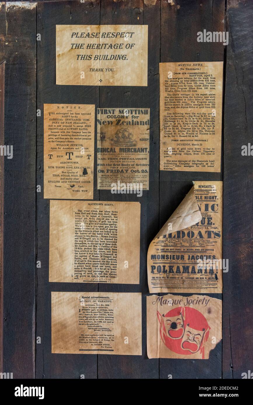 Old posters, stickers and announcements stuck on a door in a museum in ...