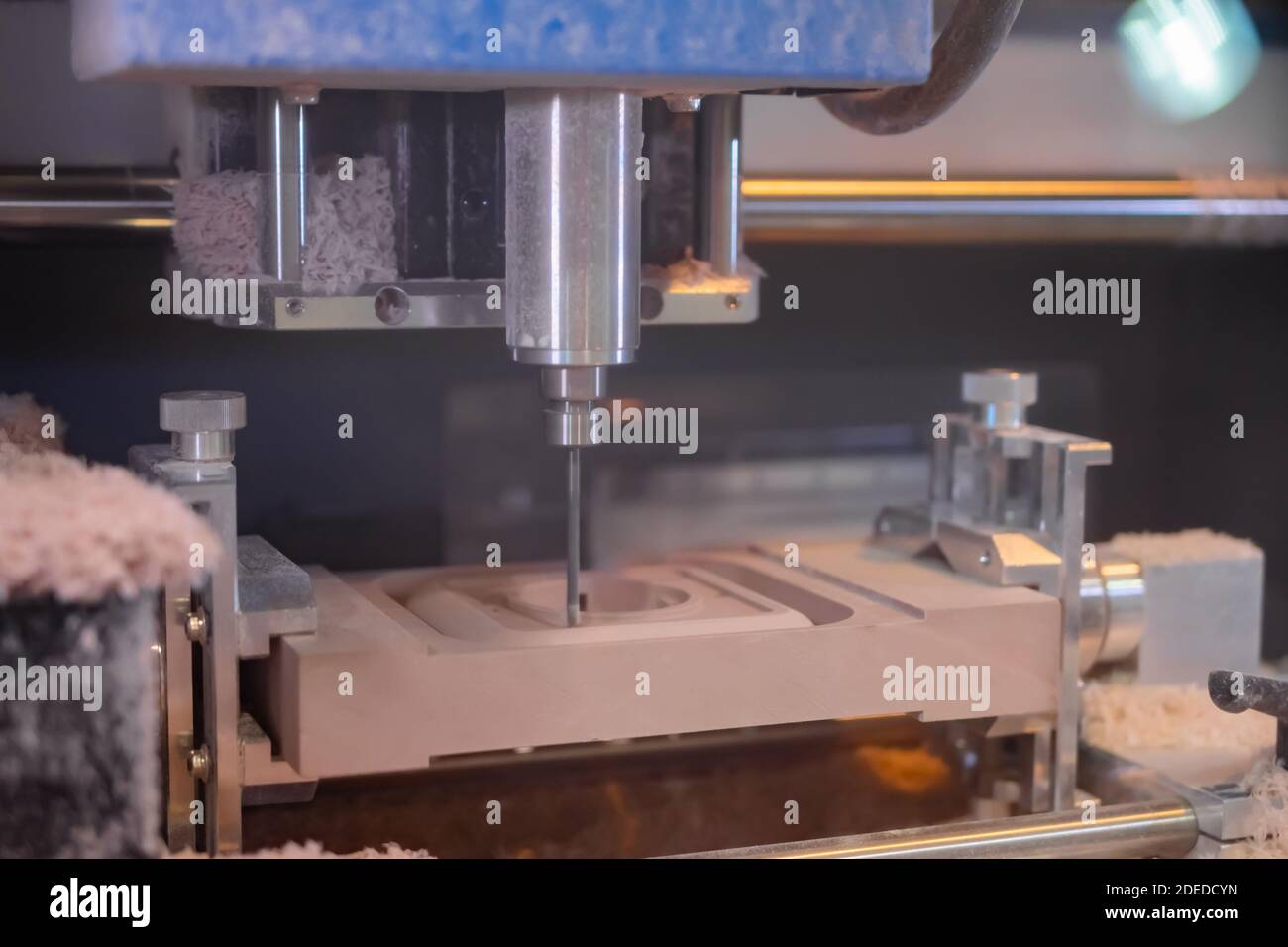 Milling machine cutting wooden workpiece from wood pulp at technology ...