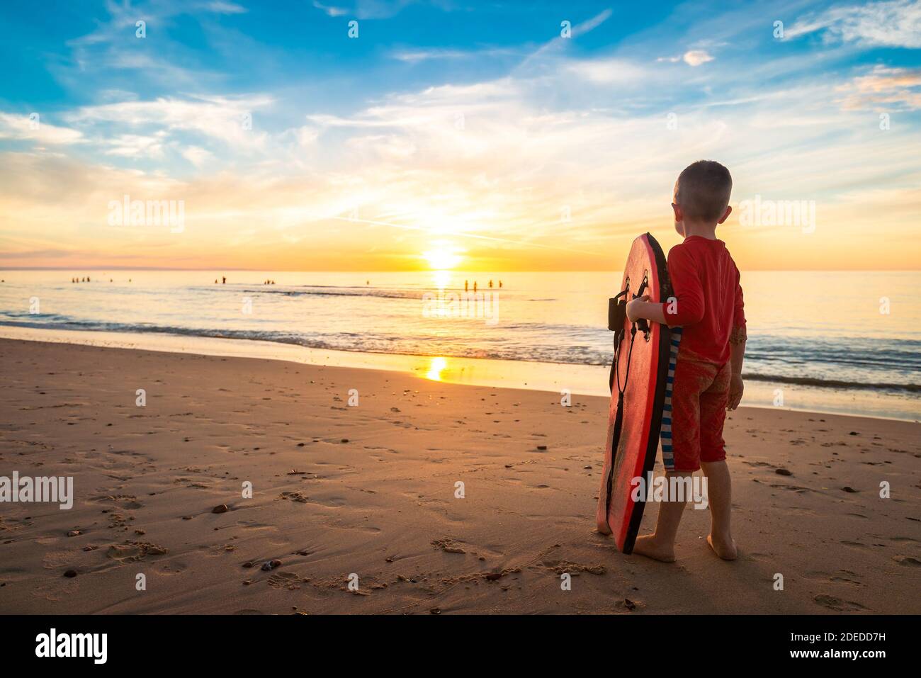 Boy standing sea watching waves hi-res stock photography and images - Alamy