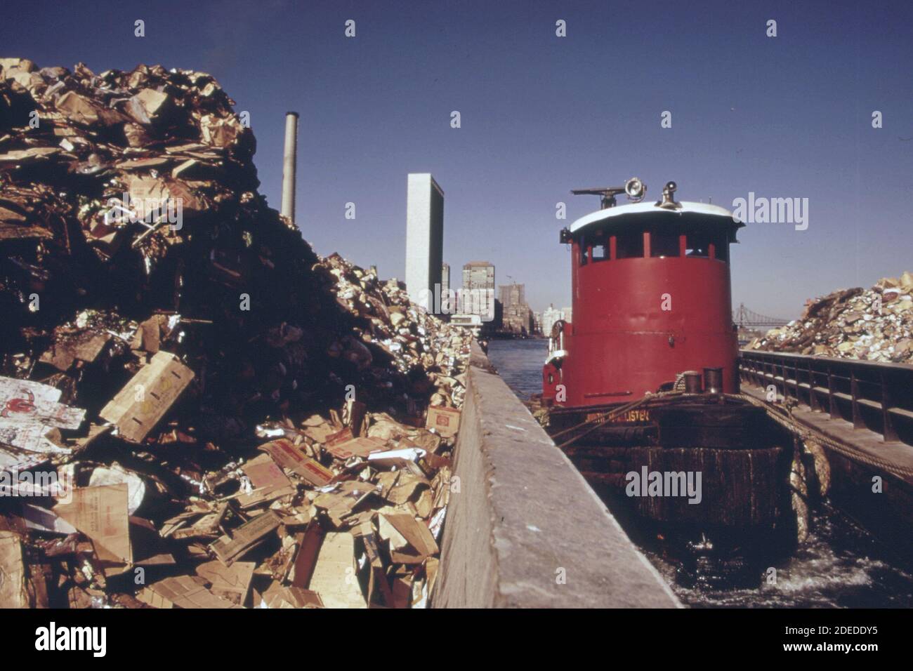1970s Photo - (1973) - Tugboat herds two laden garbage scows down the ...
