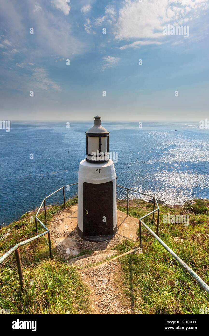The 1911 lighthouse on the east coast at Polperro, Cornwall, England ...