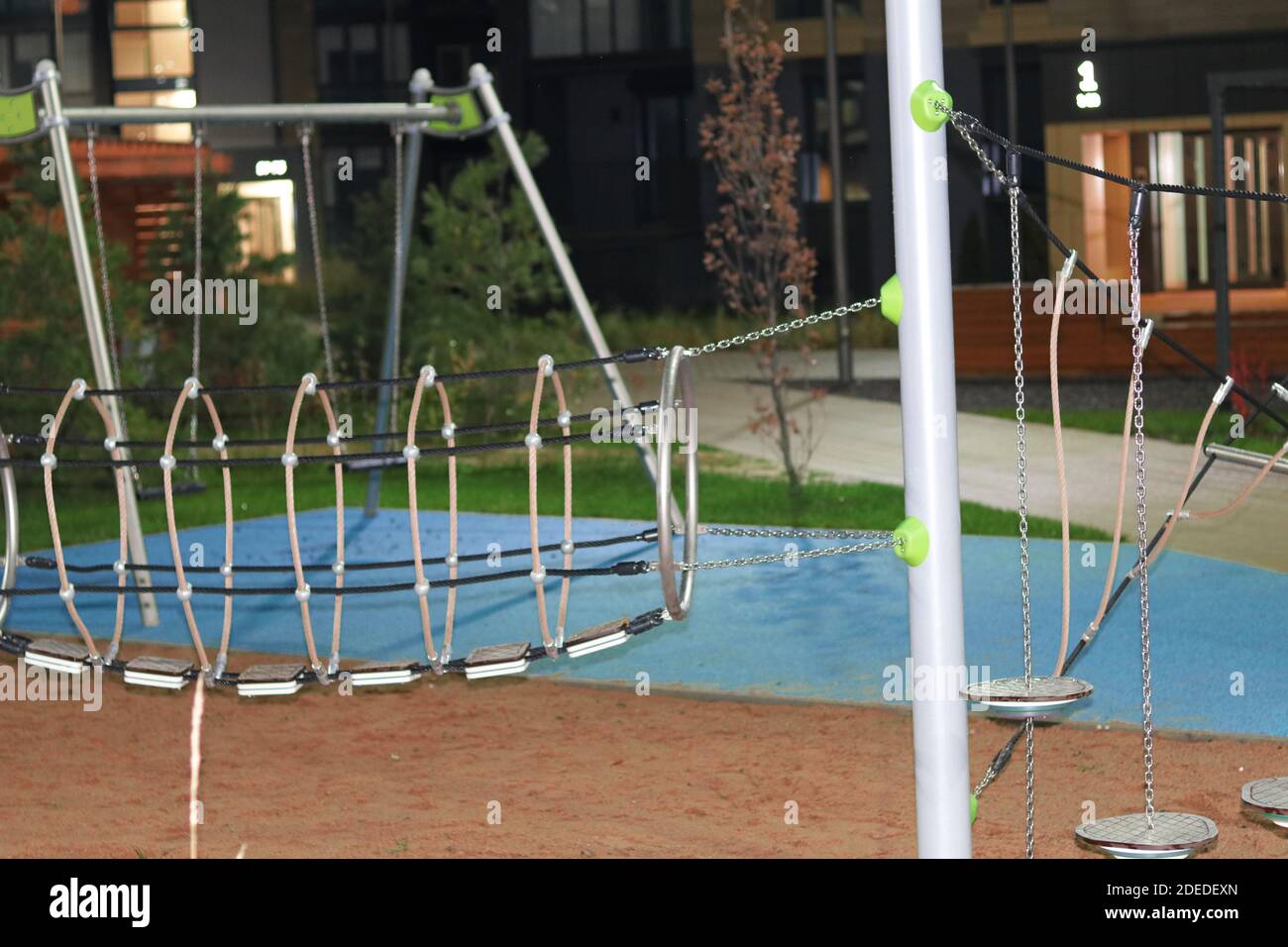 Modern playground for kids in a closed courtyard at night Stock Photo ...