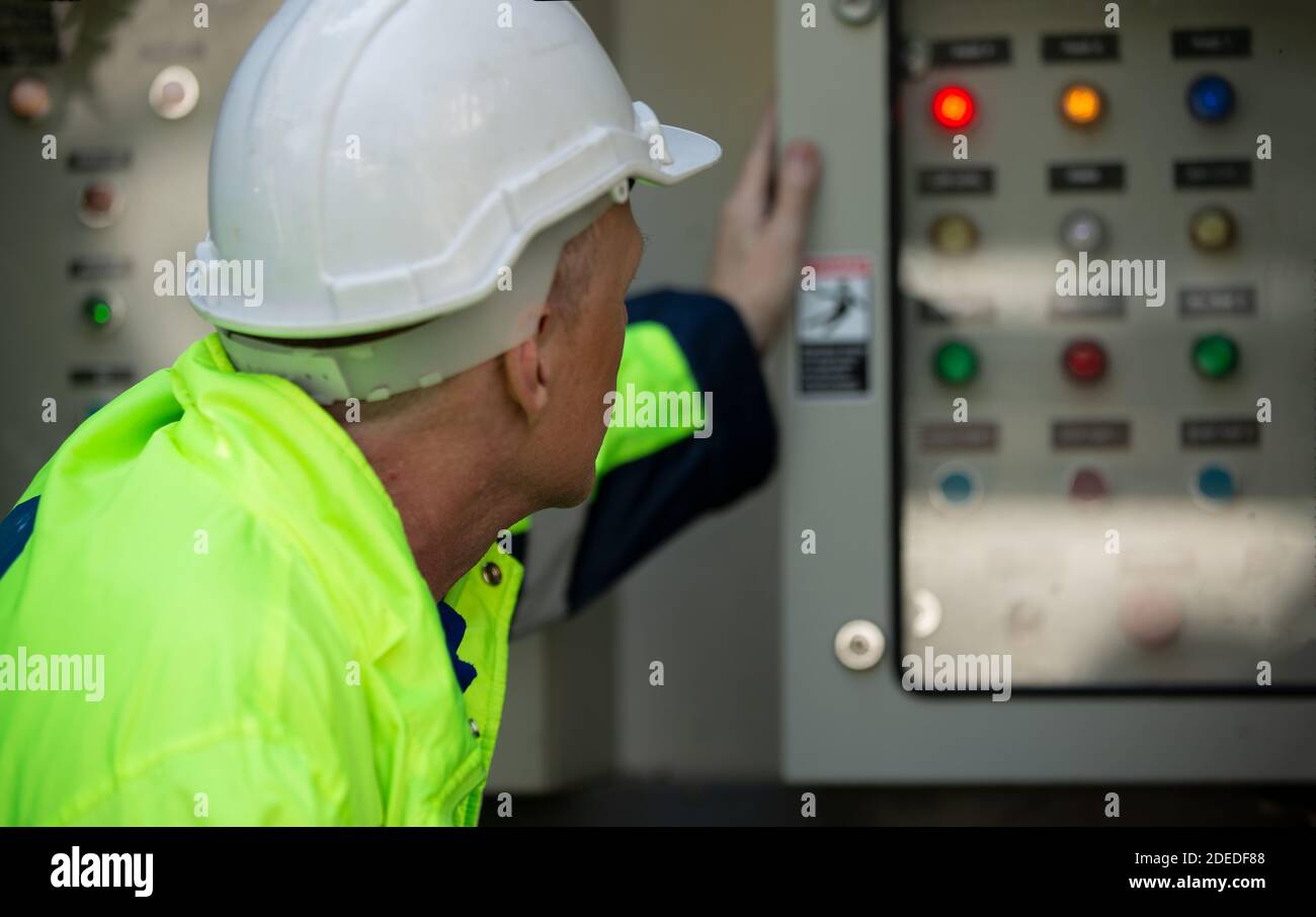 Technician checking on solar cell control panel Stock Photo - Alamy