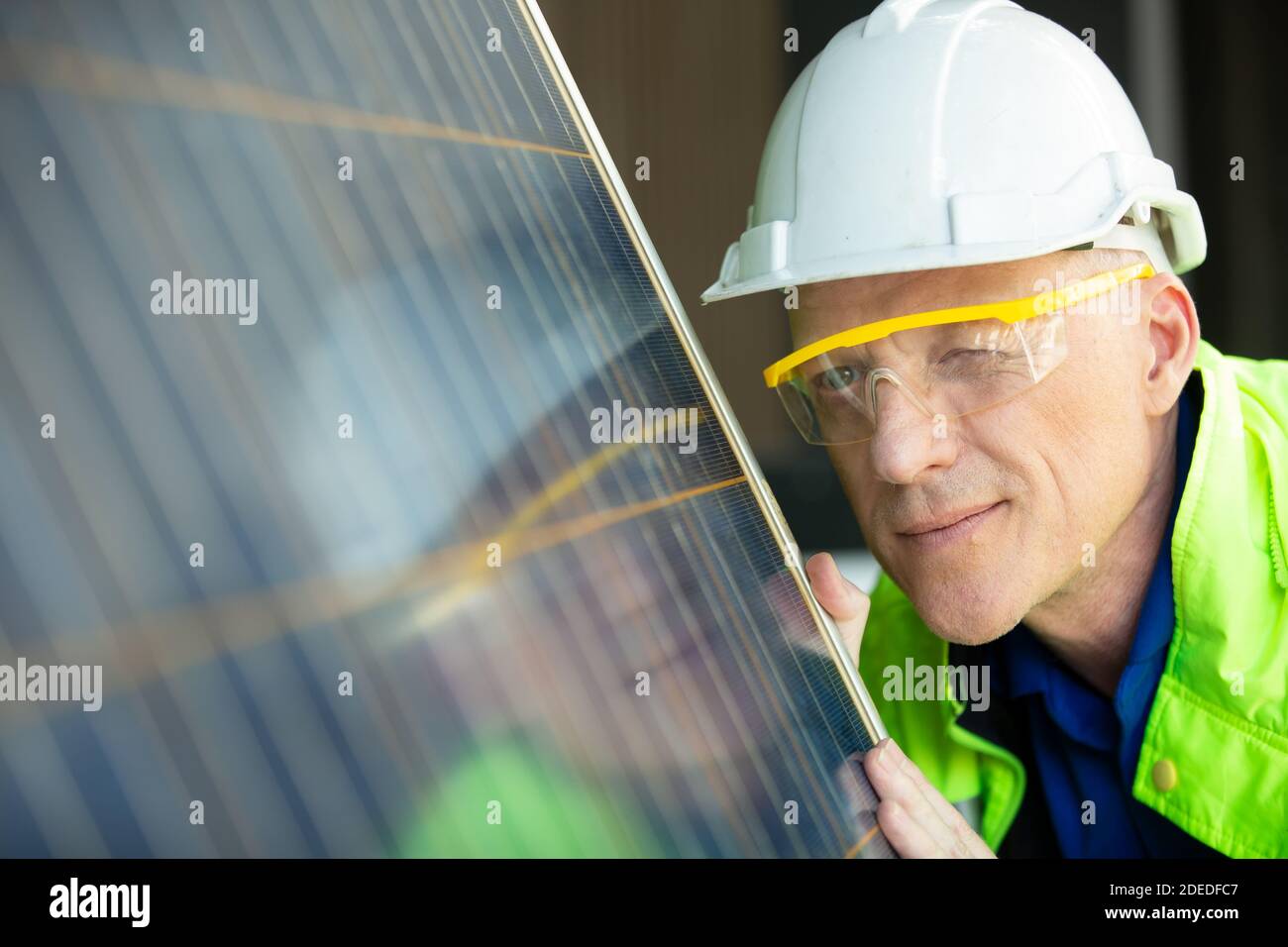 Technician checking on solar cell control panel Stock Photo - Alamy