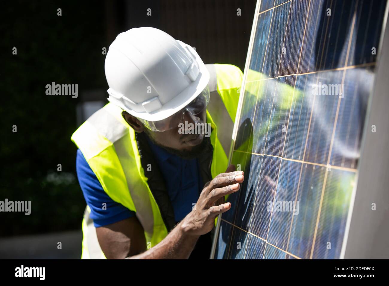 Technician checking on solar cell control panel Stock Photo - Alamy