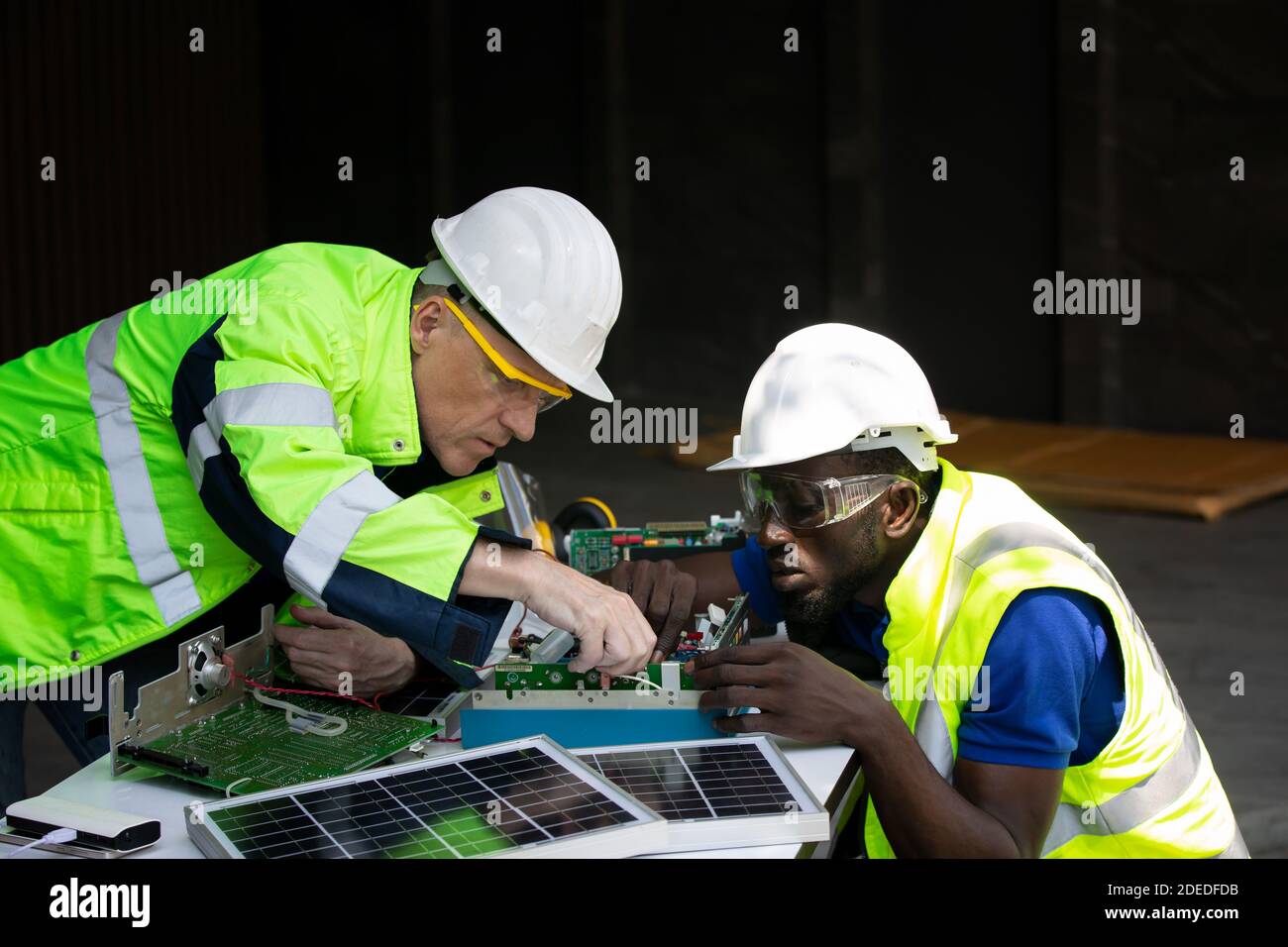 Technician checking on solar cell control panel Stock Photo - Alamy