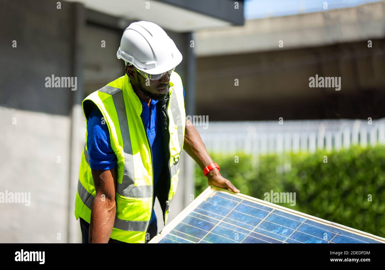 Technician checking on solar cell control panel Stock Photo - Alamy