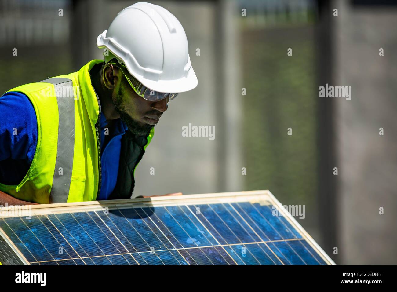 Technician checking on solar cell control panel Stock Photo - Alamy