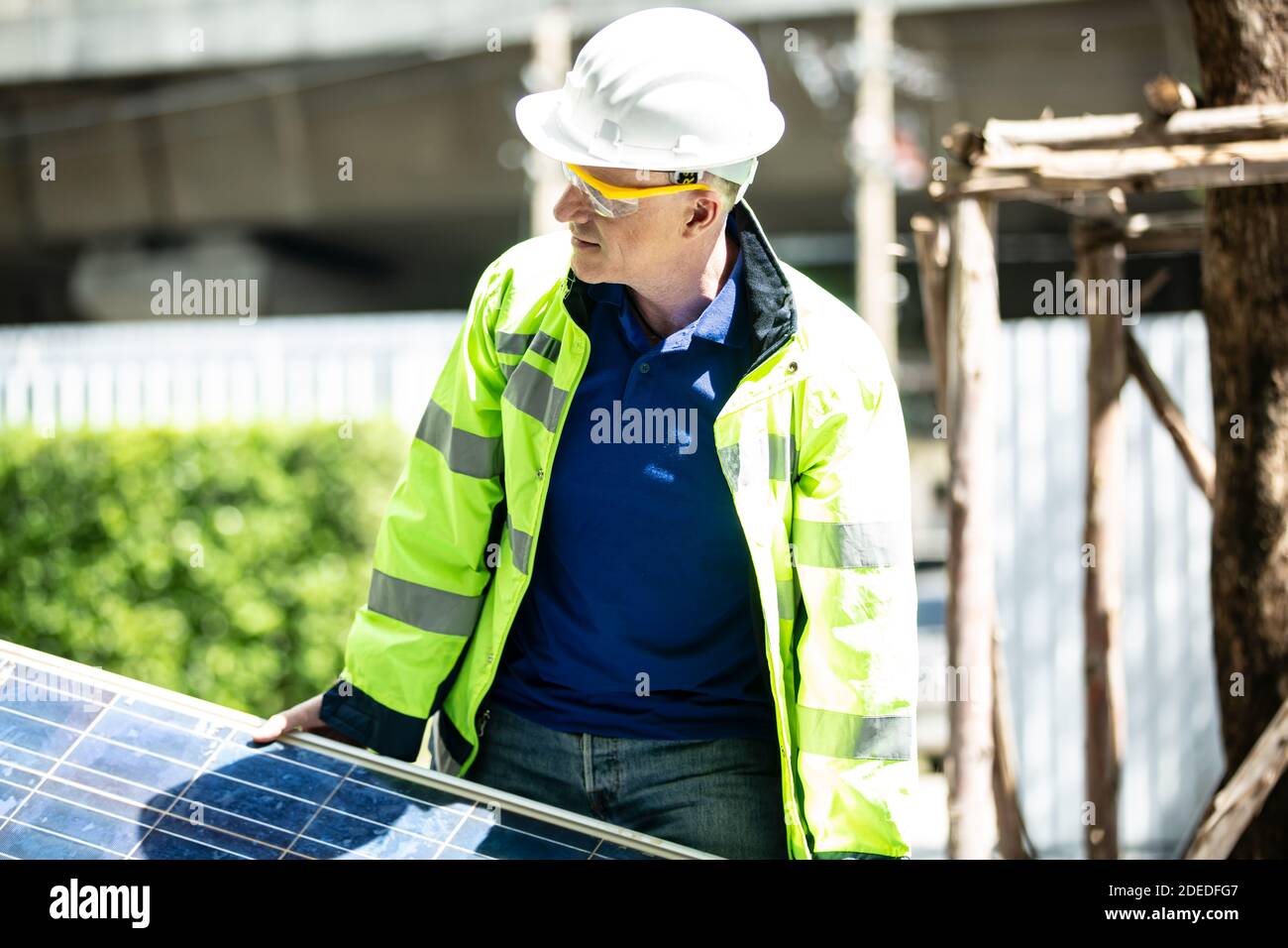 Technician checking on solar cell control panel Stock Photo - Alamy