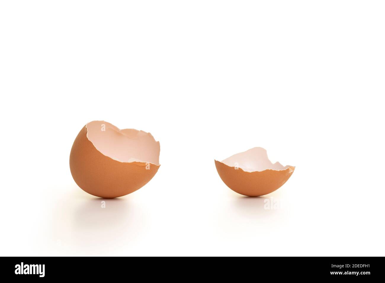 Two parts of a broken empty egg shell on a white background Stock Photo ...