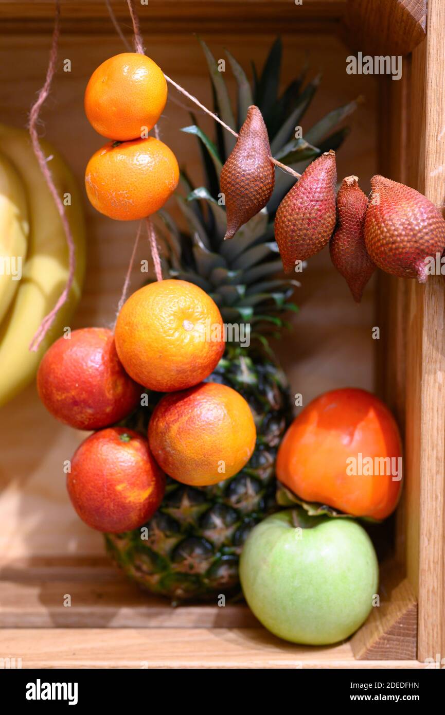 composition of exotic tropical fruit in a wooden box Stock Photo - Alamy