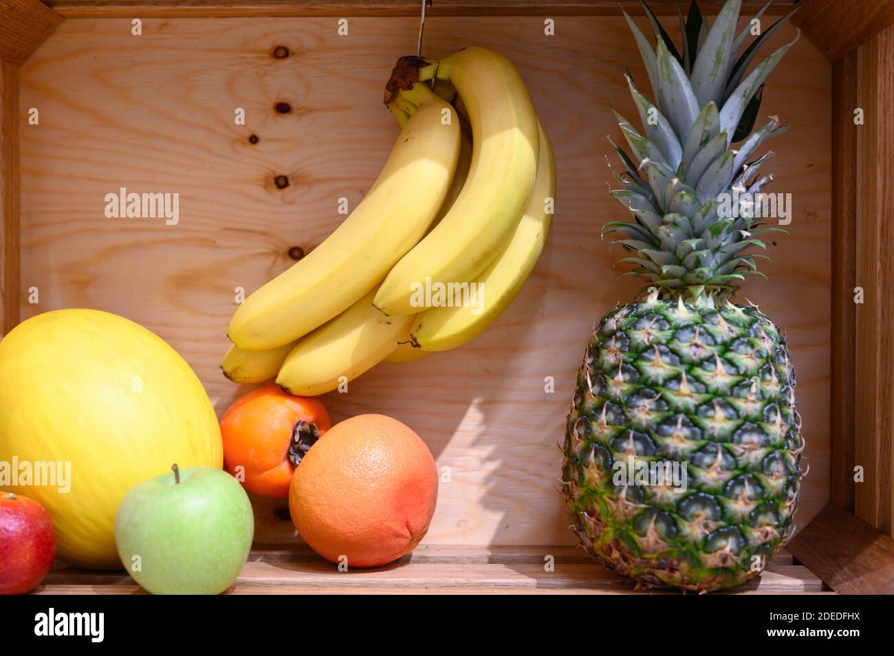 composition of exotic tropical fruit in a wooden box Stock Photo - Alamy