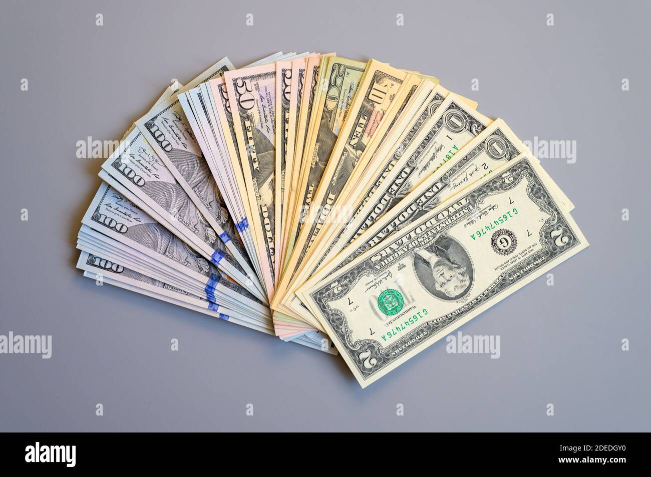 pile money fan on a gray background. American dollar bills of different ...
