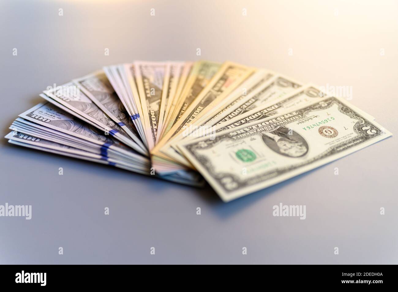 pile money fan on a gray background. American dollar bills of different ...