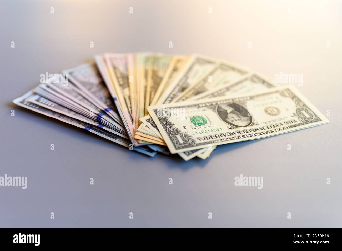 pile money fan on a gray background. American dollar bills of different ...