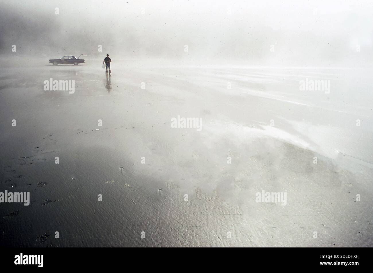 1970s man walking on empty beach hi-res stock photography and images ...