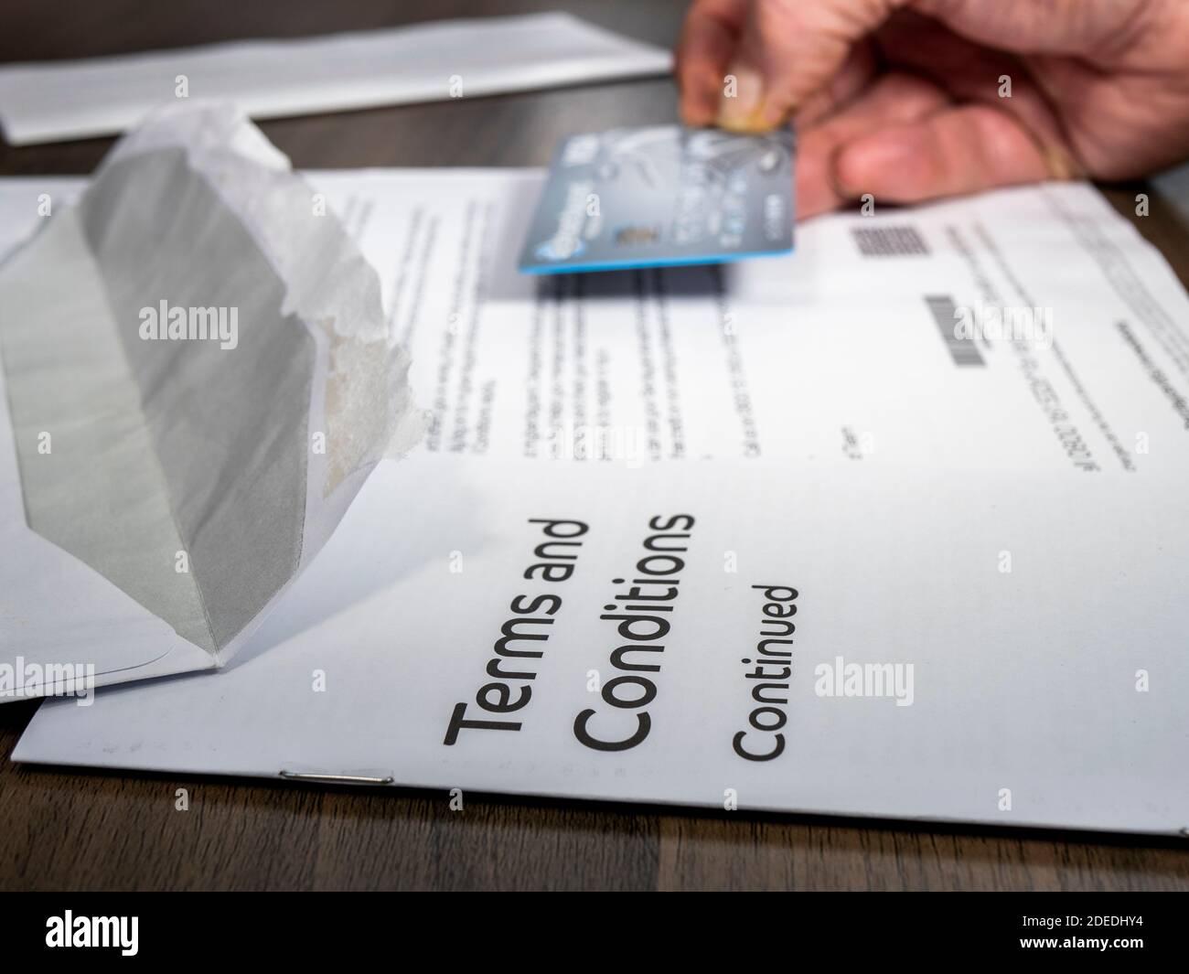 Credit card terms and conditions in focus in foreground, with defocused ...