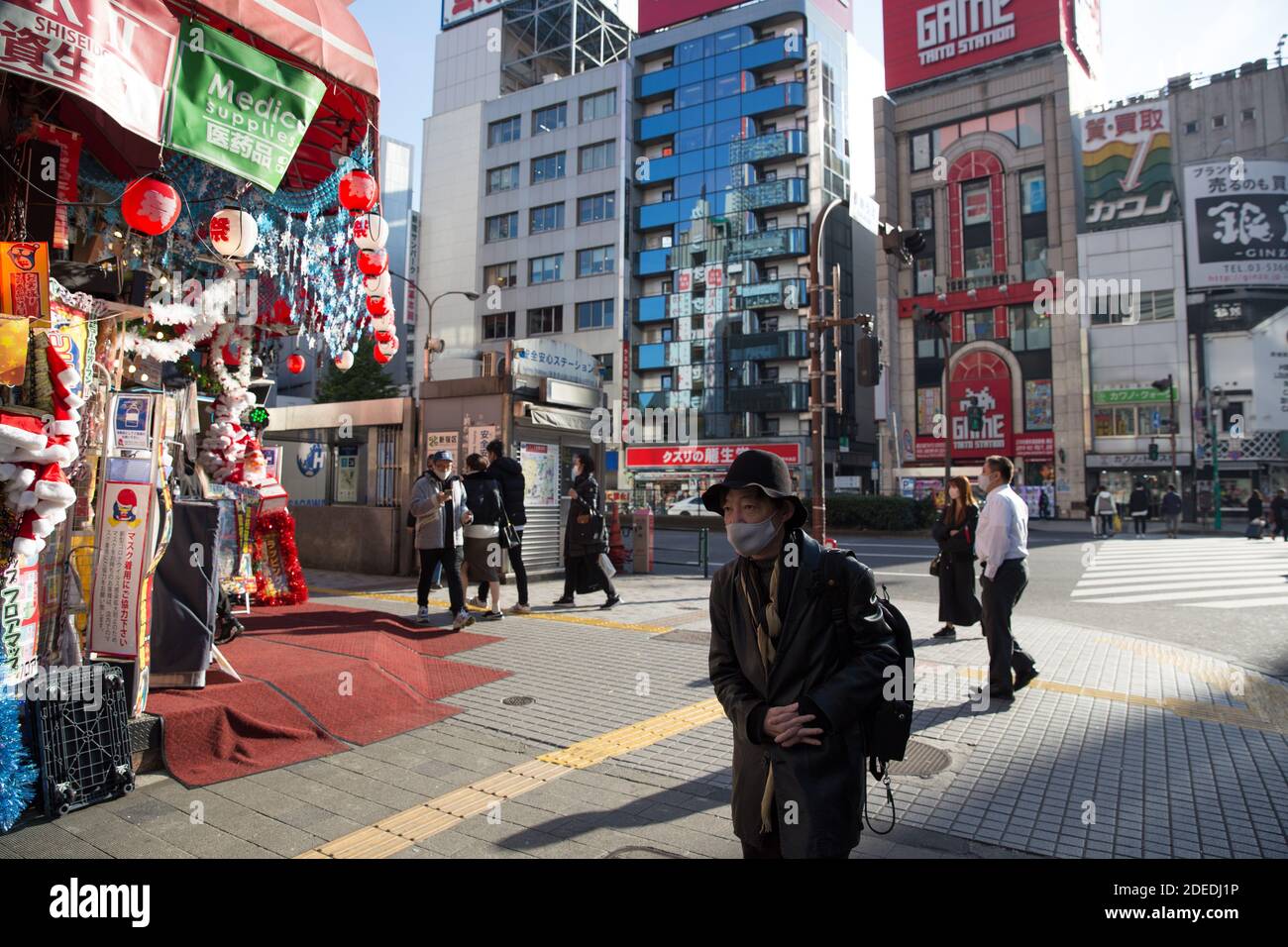 A pedestrian wearing a face mask as a preventive measure against ...