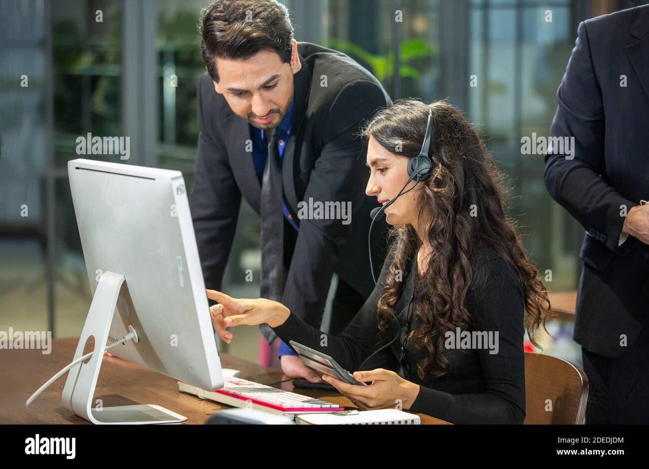 side view.the call center operator and her colleagues work in the ...