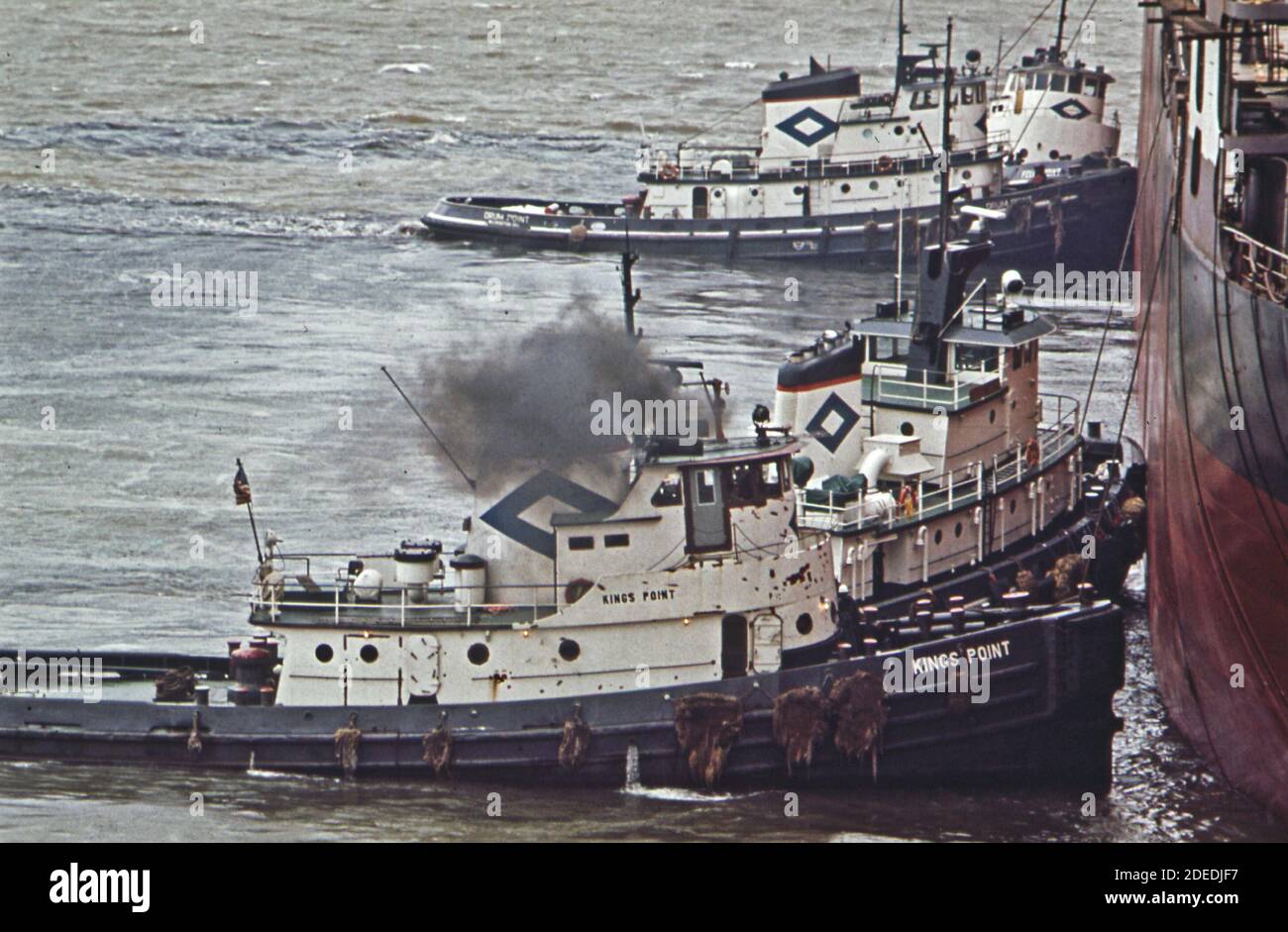 "Tugboats move the tanker ""Chevron Hawaii"" to its berth ca. 1973 ...