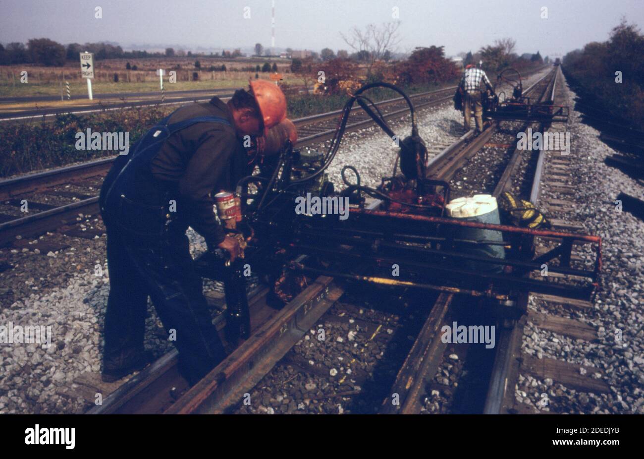 Southern Railway right-of-way worker; working with a machine that aids ...