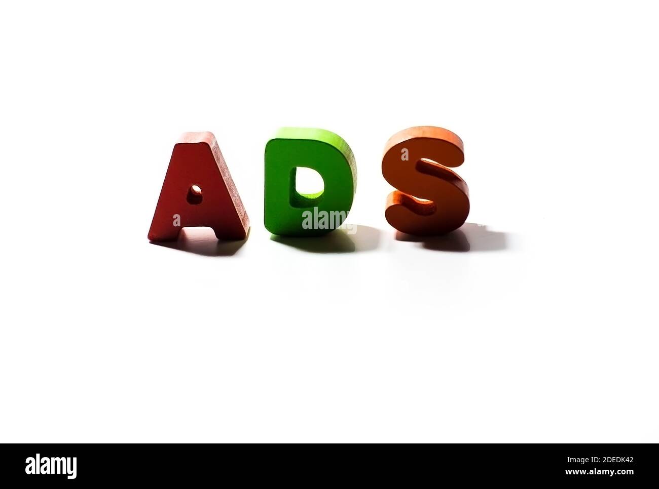 Ads word text inscription by wooden colorful carved letters standing at ...